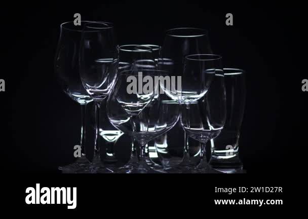 Empty glasses slowly rotating on the bar counter at the night club ...