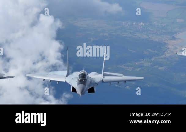 Photographers on a Cargo Aircraft take pictures of MiG-29 fighter jets ...