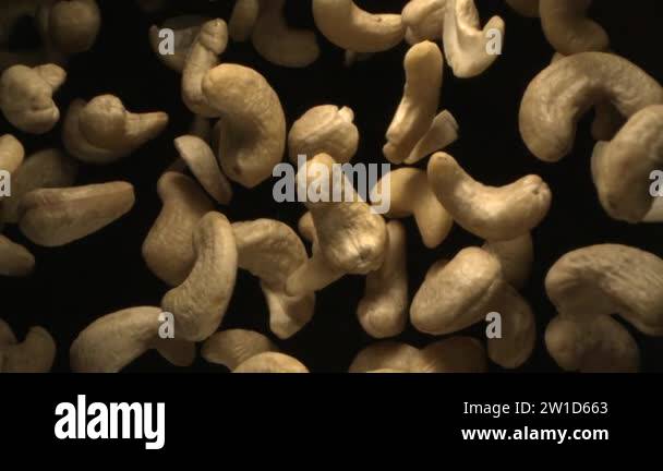 Cashew Nuts Flying in the Air in a Free Fall in Slow Motion on Black ...