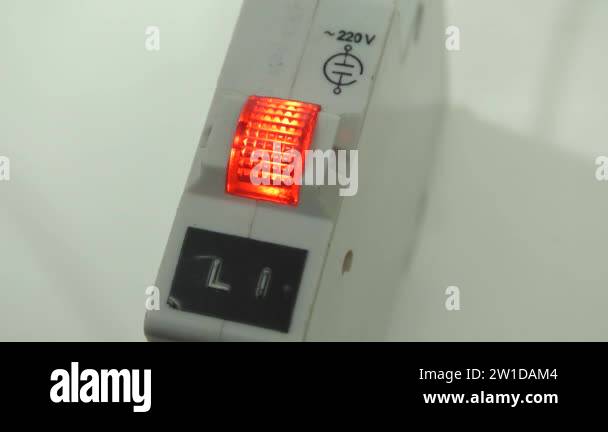 Indicator lamp 220 V on a DIN rail. The indicator determines the ...