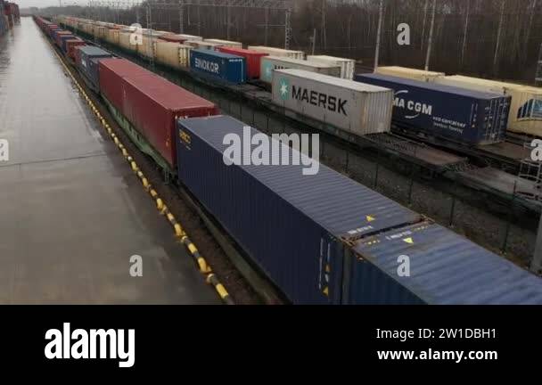 The fly of the camera over the cargo terminal: visible railway tracks ...