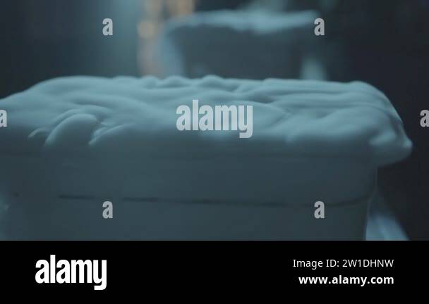 Multi-colored vapors of liquid nitrogen in a container, background ...