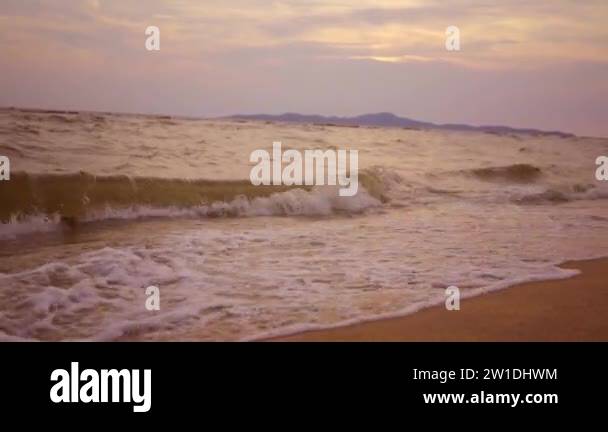 Red sunsets over sea video 4K. The sun touches horizon. Red sky, yellow sun and amazing sea ...