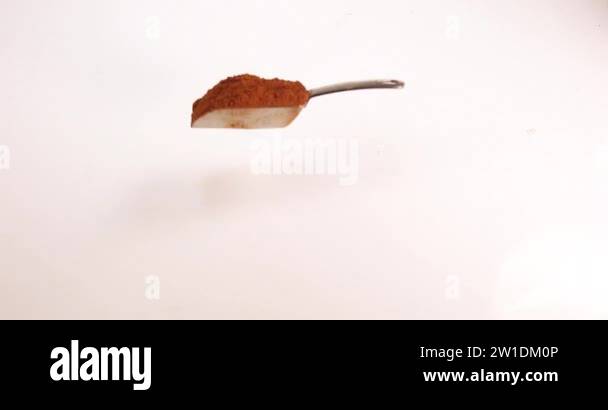Nutmeg, myristica fragans, powder falling against White Background ...