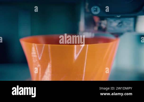 Modern printer shaping a form with plastic in a 3d printing lab Stock ...