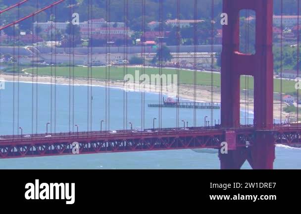 Traffic on the suspension bridge spanning the Golden Gate, the one-mile ...