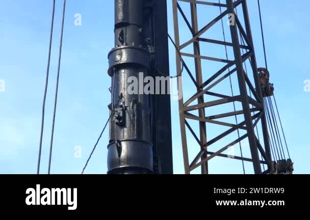 Machine drives into the ground piles construction. Construction of the ...