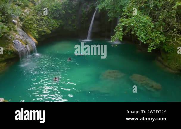 Kawasan Falls on Cebu Island, Philippines. People swimming at the ...