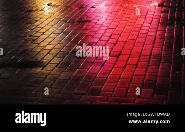 reflection of colored lights on the pavement at night. shine cobbled ...