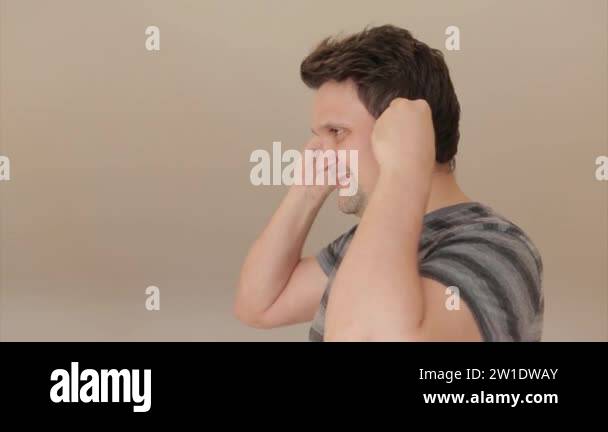 the guy puts a wireless headset in his ear and starts talking on the ...