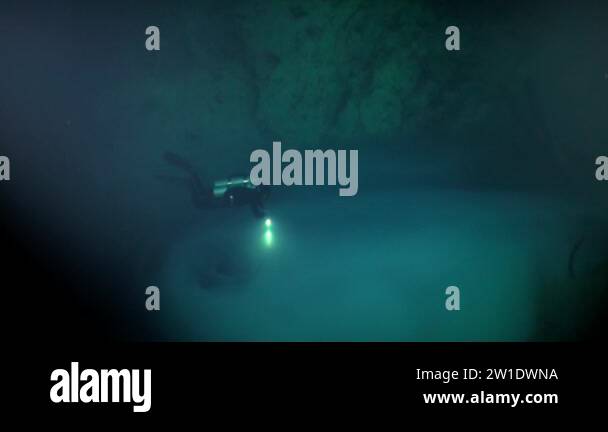 Diver disappears in muddy water of halocline in cenotes in Mexico Stock ...