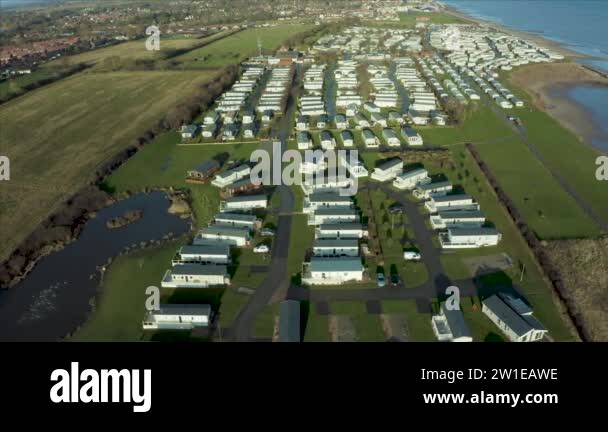 Aerial footage of stationary caravan holiday homes in a trailer park ...