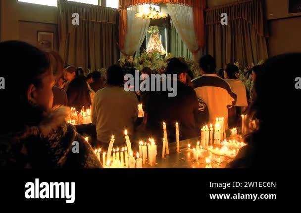 Quillacollo, Cochabamba / Bolivia - 08 15 2019: People praying to the ...