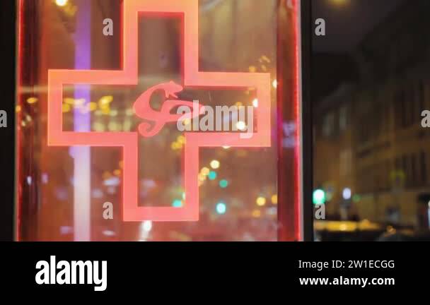 medical cross sign neon sign with a snake. illuminated first aid ...