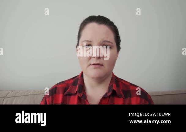 Sad cute girl talking by video call. Sad facial expression. Human ...