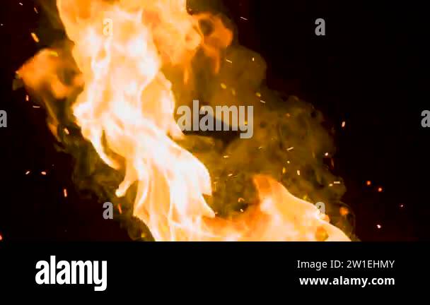 Flame and Spark Flow. Tongues of flame and red-hot sparks slowly soar ...