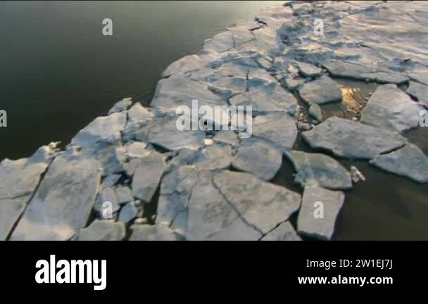 Ice floes float on the river in the spring. Ice drift-movement of ice ...