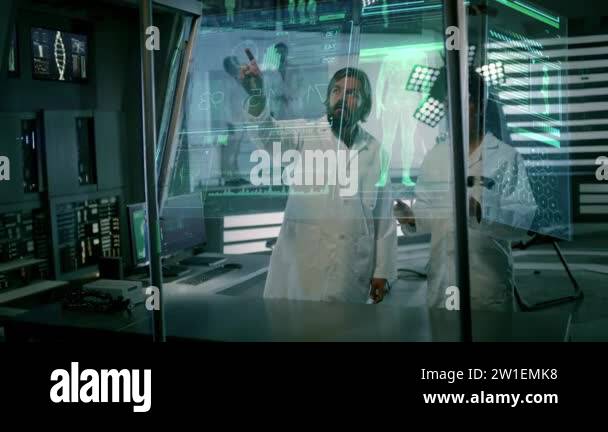 Scientists working on EEG Headset technology with female patient. Scientist analyzes Neuronal ...