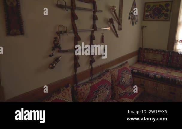 Guns hanging on the wall of the house in the Middle East. Traditional ...