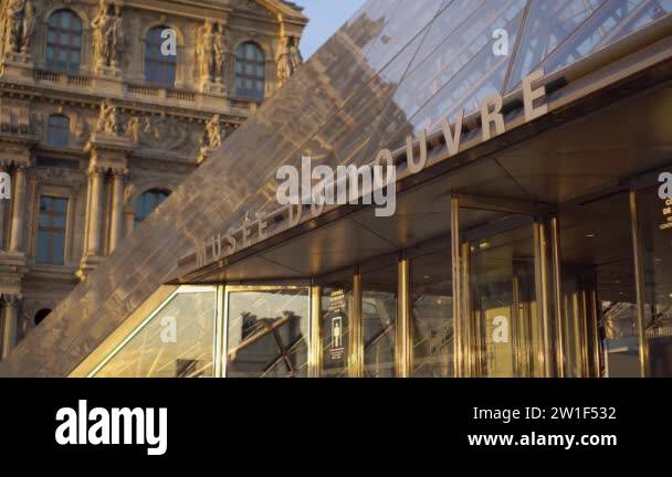 Sign MUSEE DU LOUVRE. Installed on a pyramid of glass and iron. Paris ...