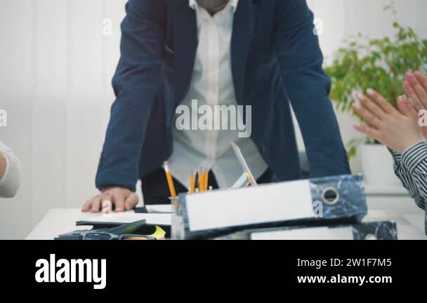 4k slowmotion video of satisfied boss with his workers putting hands ...