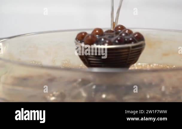 Cooking, boiling brown sugar flavor tapioca pearl balls, ingredient of ...
