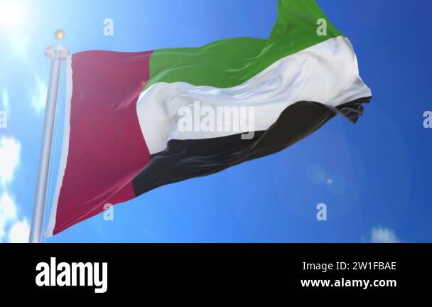 United Arab Emirates animated flag in the wind with blue sky in the ...