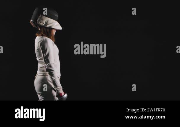 Side view portrait of a professional woman fencing athlete which puts ...