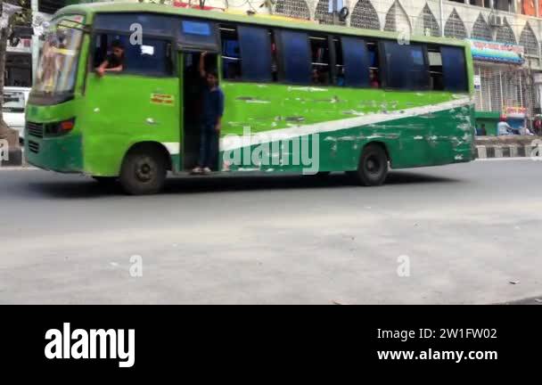 Unidentified people and street traffic at the Ring Road in the Adabor ...