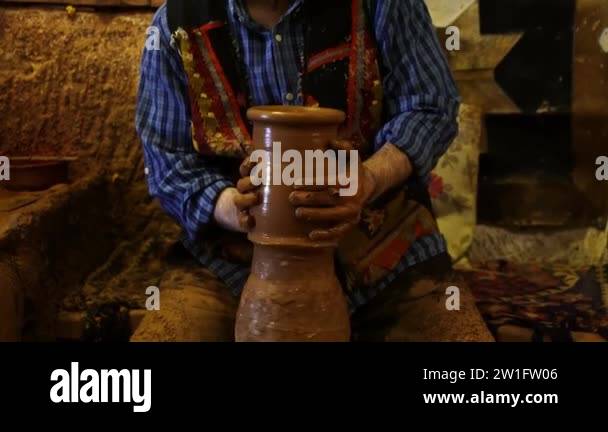 Potters wheel, hands forms clay pot on potter's wheel, Experienced ...