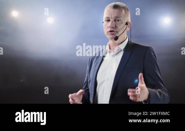 Showman. Middle Age Male entertainer, presenter or actor on stage. Arms ...