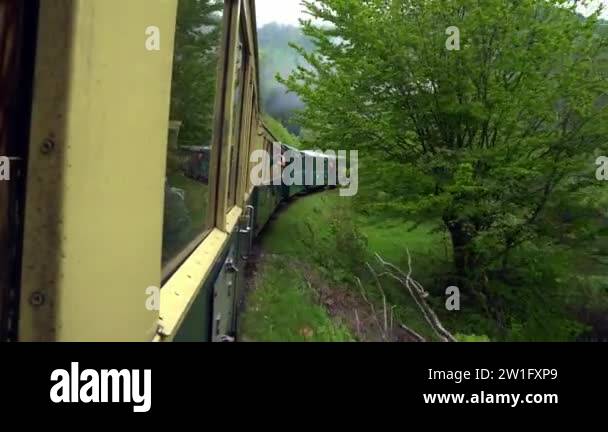 view from the window of a retro train wagon, Old steam locomotive in ...