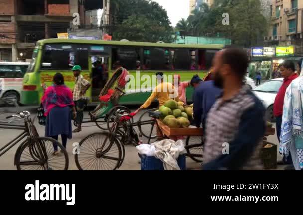 Unidentified people and street traffic at the Ring Road in the Adabor ...