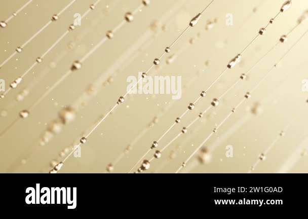 Abstract animation of water drops gliding along lines on golden ...