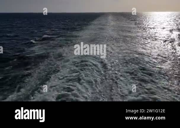 Powerful waves following the ship. Track from the engines of the ship ...
