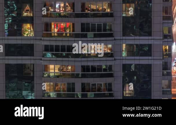 Night view of exterior apartment building timelapse. High rise ...