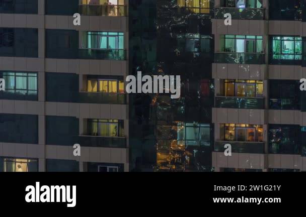 Night view of exterior apartment building timelapse. High rise ...