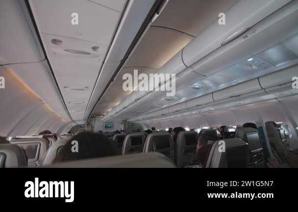 Passengers are sitting in chairs in the cockpit. Onboard the plane a ...