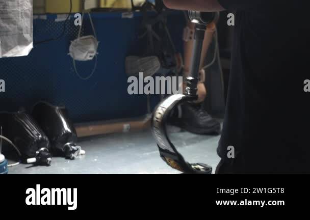 Production of a prosthetic leg. A man creates part of the leg. An ...