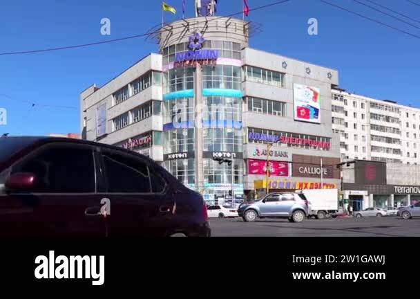 Street traffic at the Nomin Plaza, a large department store in Ulaanbaatar, the capital of ...