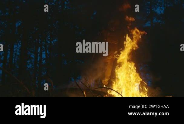 firefighter hero in action danger jumping over fire flame to rescue and ...