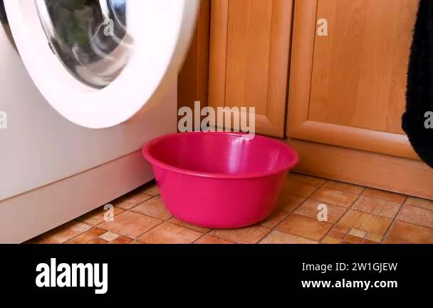 Washing clothes. Washer machines take clean clothes from washing ...