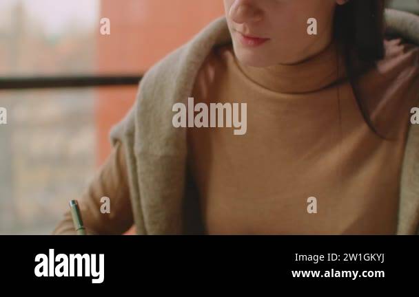 Calligrapher hands writes phrase on white paper. Inscribing ornamental ...