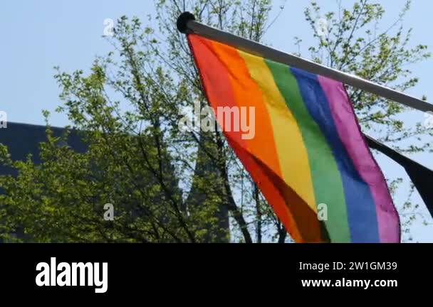 Gay pride rainbow flag LGBT flying. A multi-colored rainbow flag, a ...