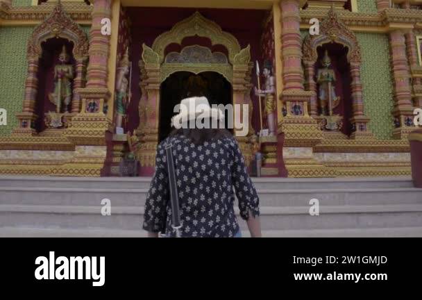 Asian woman tourist walking in the buddhist temple and admire to see a ...