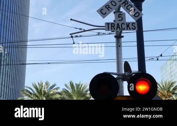 Level crossing warning signal in USA. Crossbuck notice and red traffic ...