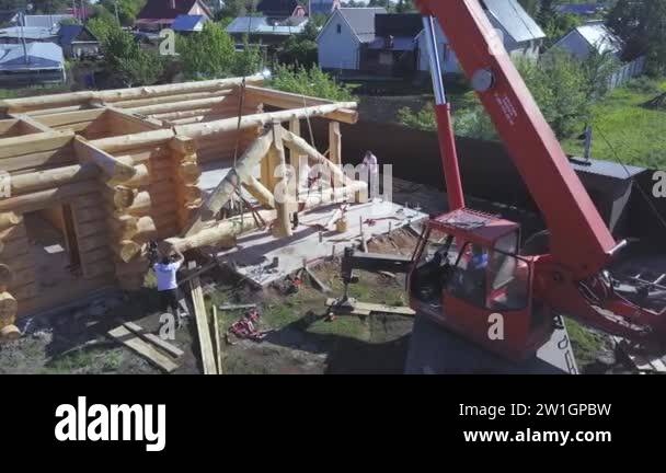 Construction industry concept, aerial of workers trying to install the ...
