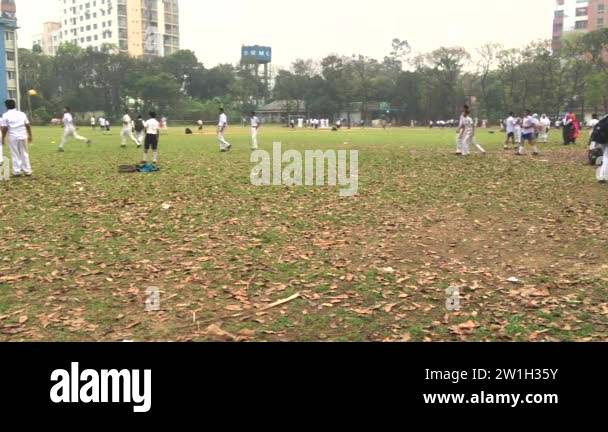 Young students playing cricket at the Dhaka Residential Model College in Mohammadpur, Dhaka, the ...