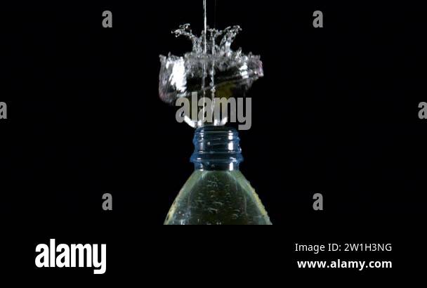 Water Exploding and Splashing on Bottle against Black Background, Slow ...