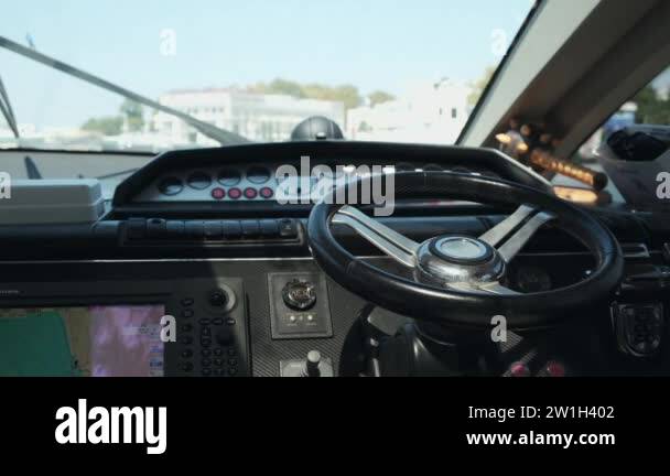 yacht with instruments and steering wheel the hands of the captain ...